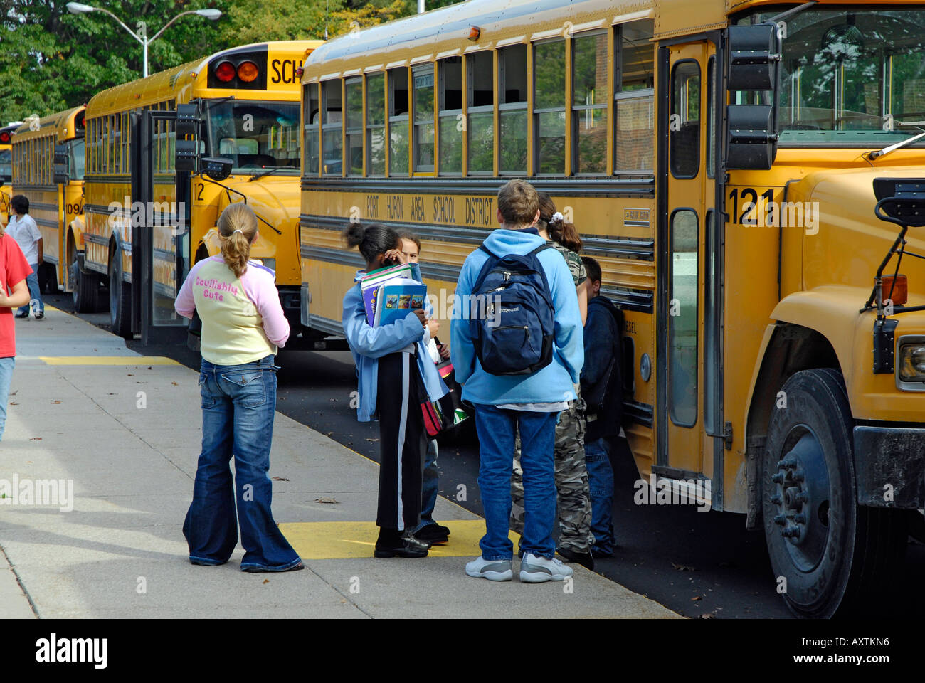 Yellow school busses transport student to and from school Stock Photo ...