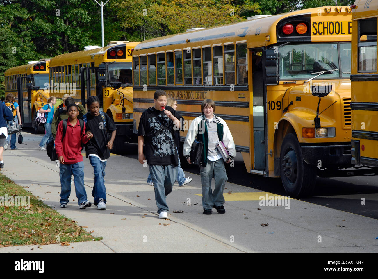 Yellow school busses transport student to and from school Stock Photo ...
