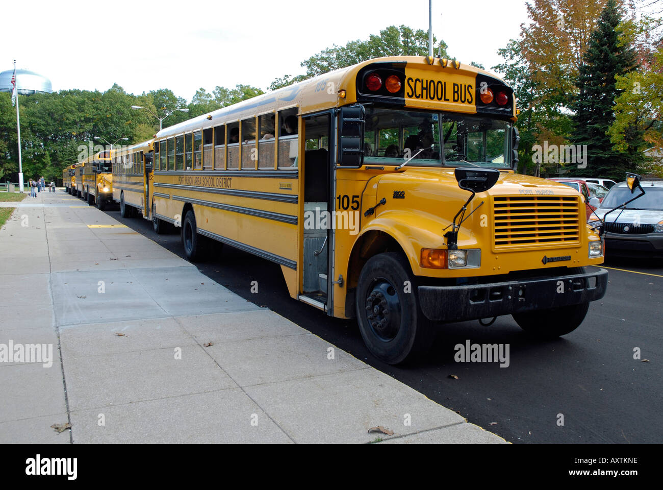 Yellow school busses transport student to and from school Stock Photo ...