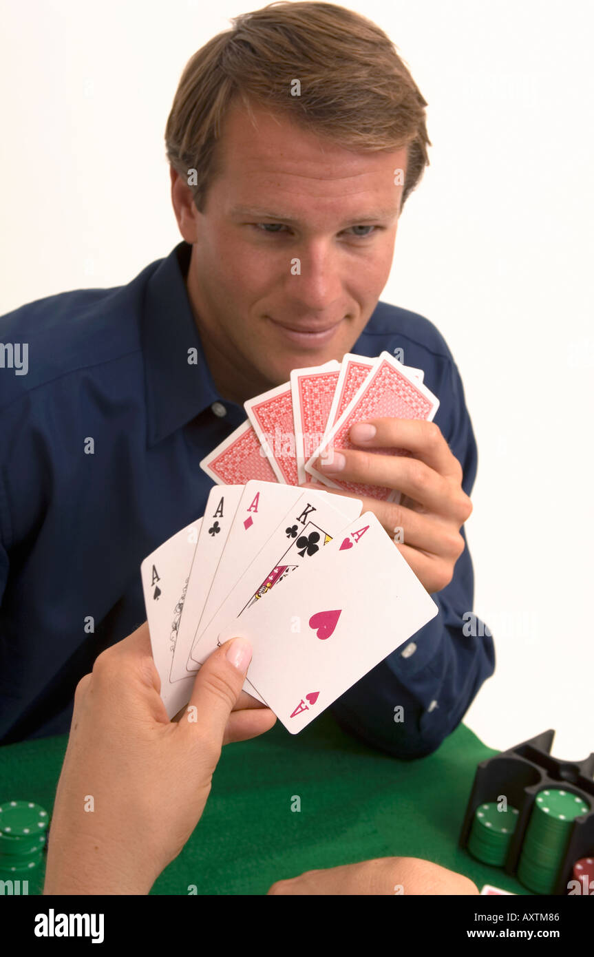Portrait of a man playing poker Stock Photo - Alamy