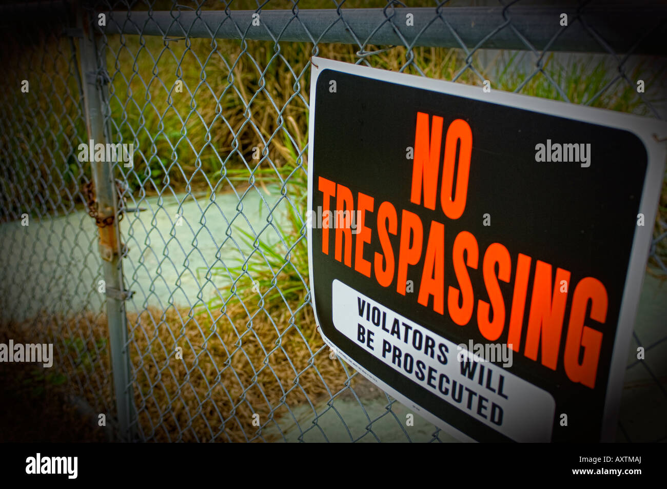 No Trespassing sign on neglected property Stock Photo - Alamy