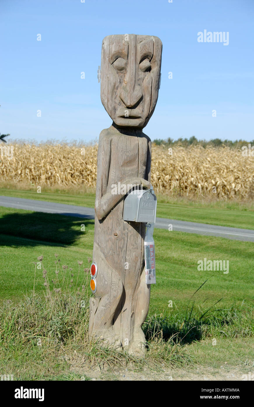 Totem pole built around a mail box Stock Photo - Alamy