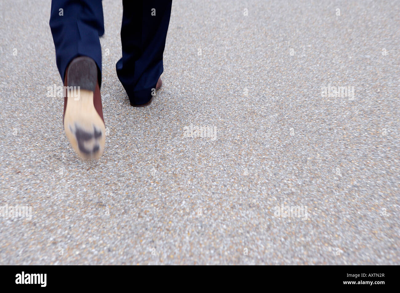 Feet of man walking on street Stock Photo - Alamy