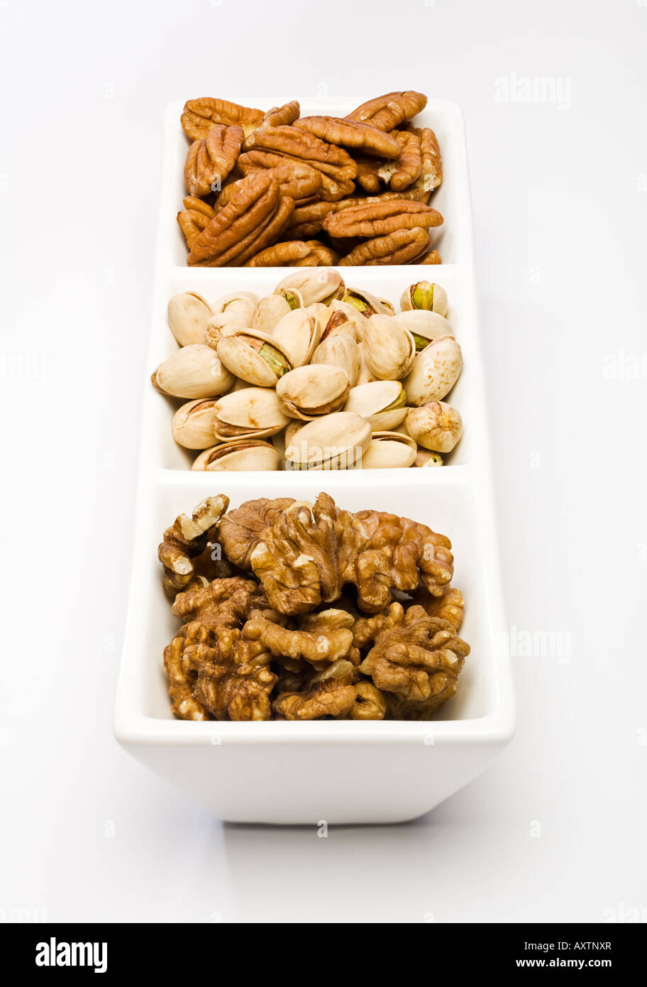 Three types of nut kernel Shelled Walnuts Pistachios and Pecans Stock ...