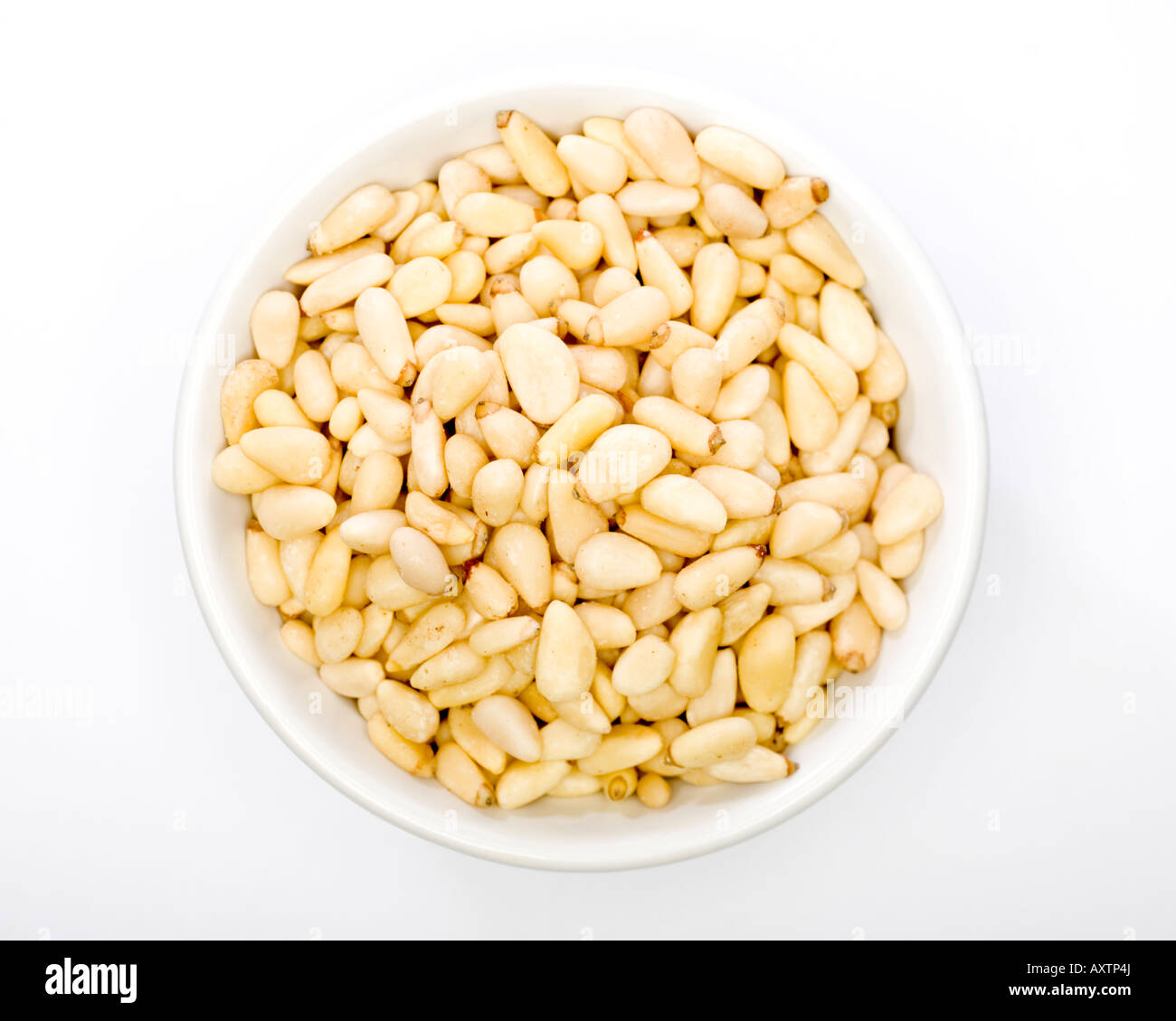 Korean Pine nut kernels in a white bowl Stock Photo - Alamy
