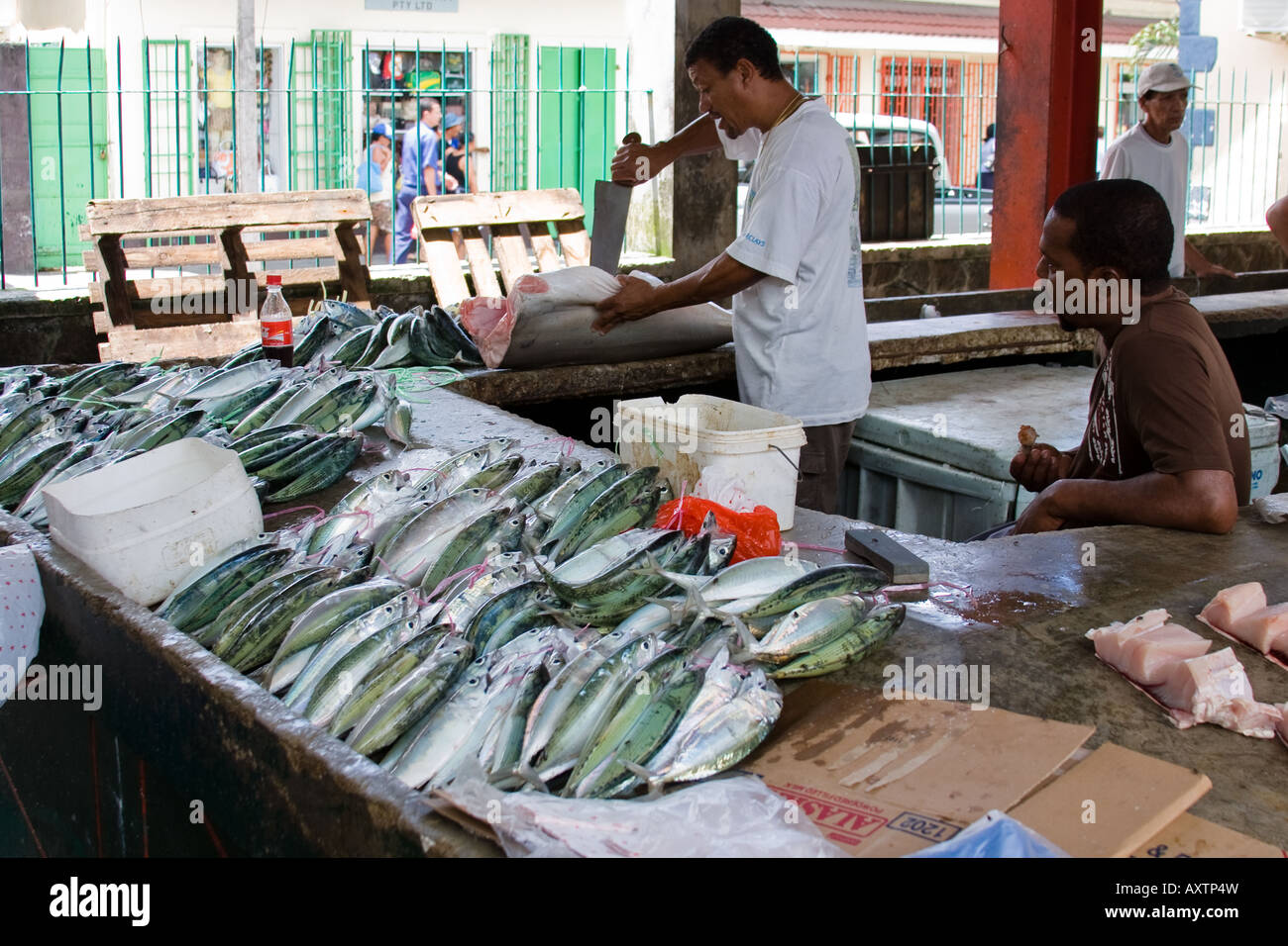 Fishmonger cutting fish - Victoria market, Seychelles Stock Photo - Alamy