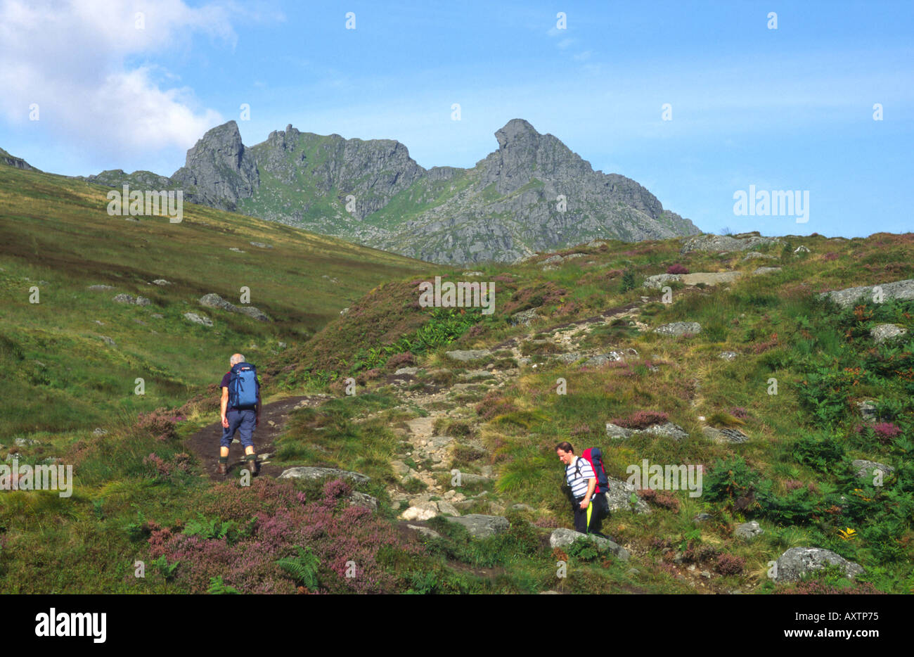 Two men walking up towards the Cobbler in the Arrochar Alps, near ...