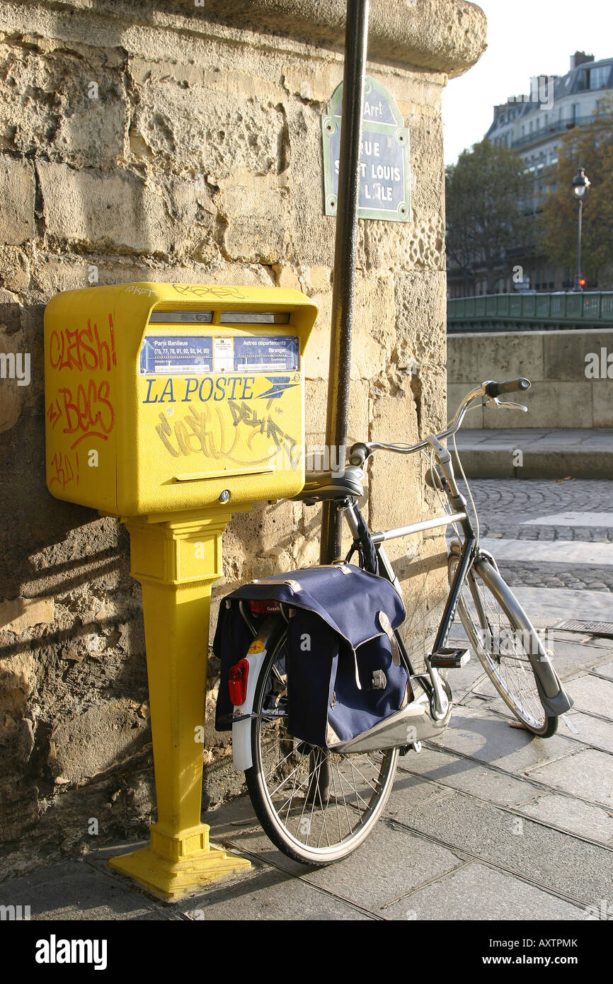 Yellow Post Box with Bicycle Stock Photo - Alamy