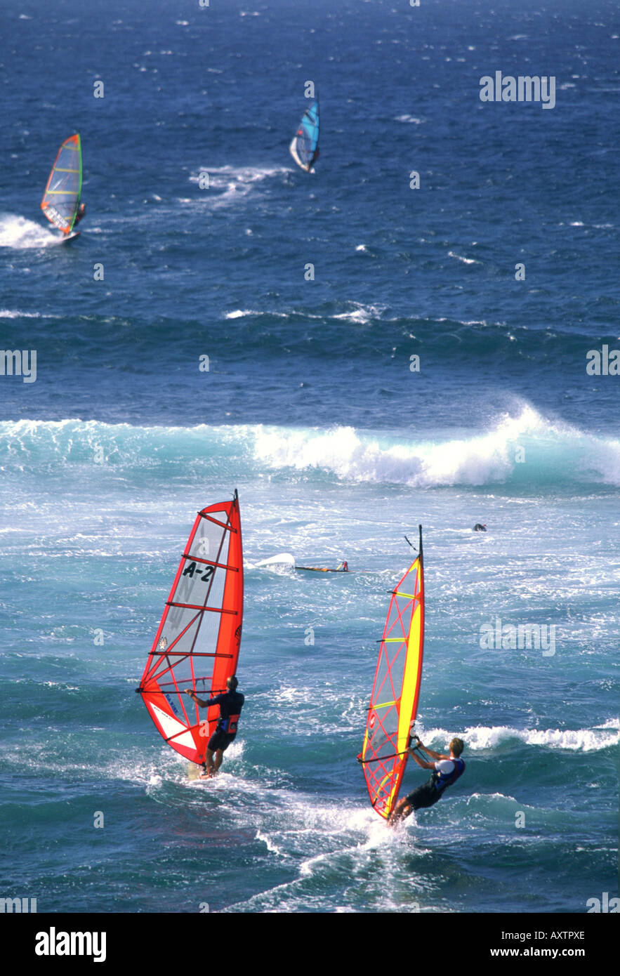Windsurfers jumping waves hi-res stock photography and images - Alamy