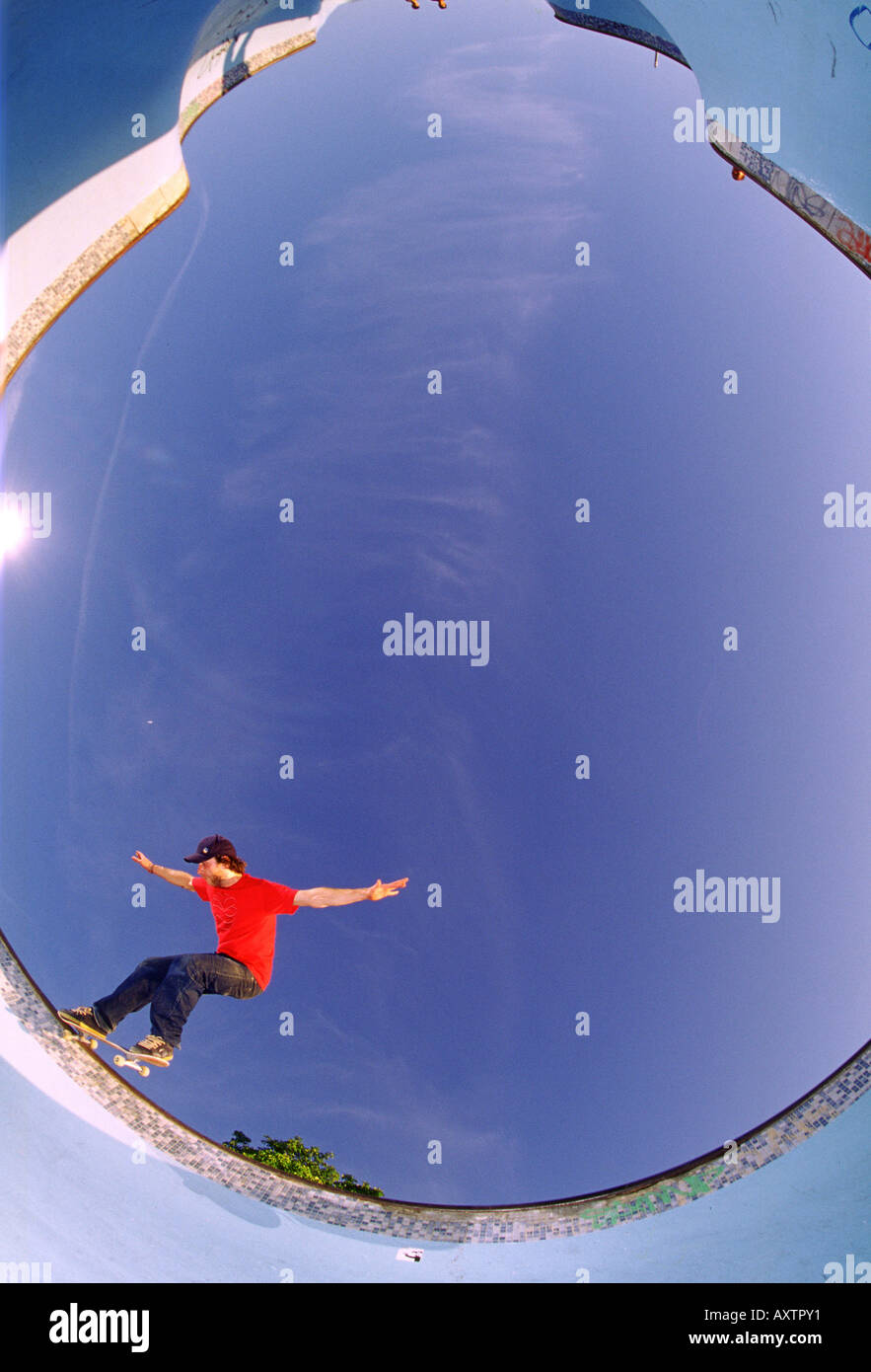 Skateboarding in empty swimming pool (fish-eye lens Stock Photo - Alamy