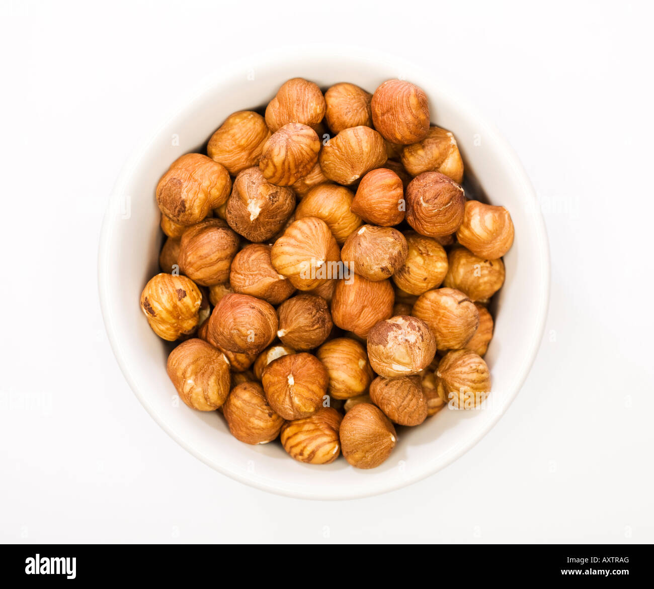 Hazelnut or cobnut kernels in a white bowl Stock Photo - Alamy