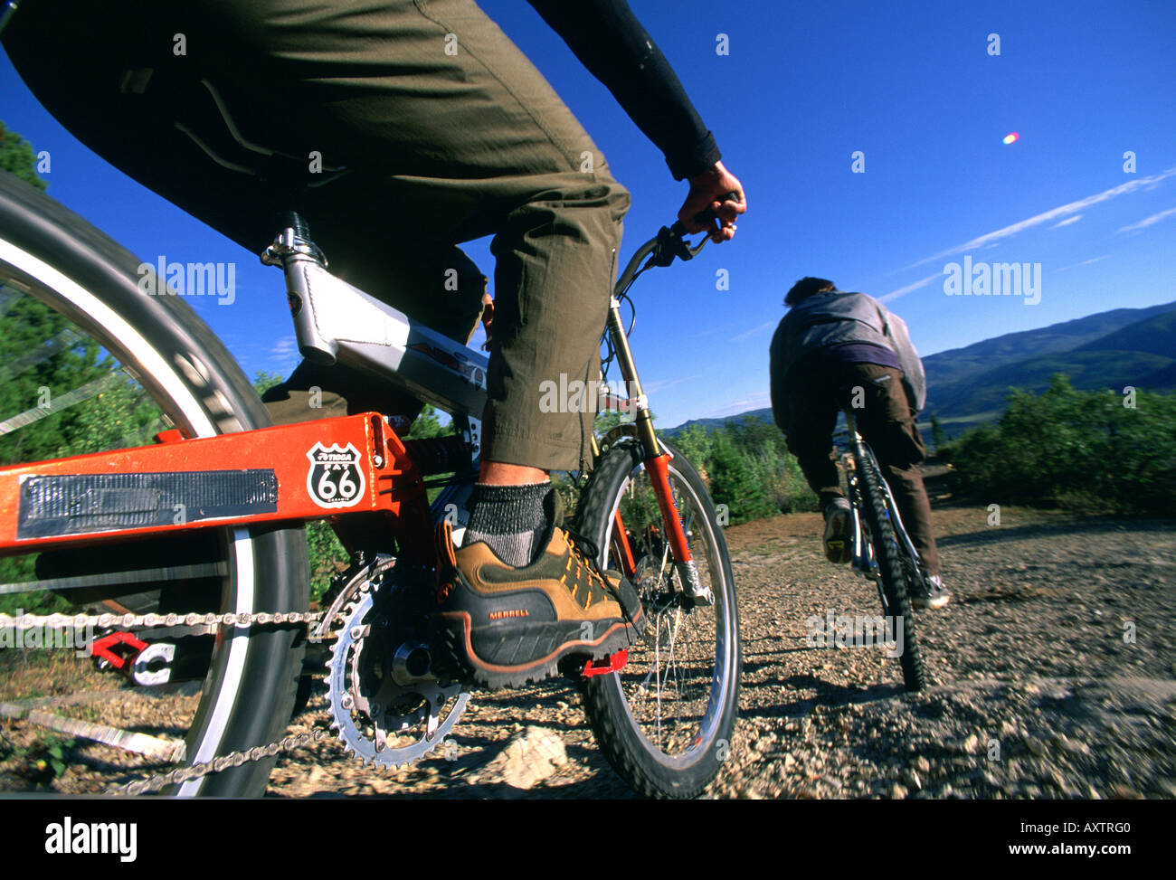 Two people mountain biking Stock Photo - Alamy