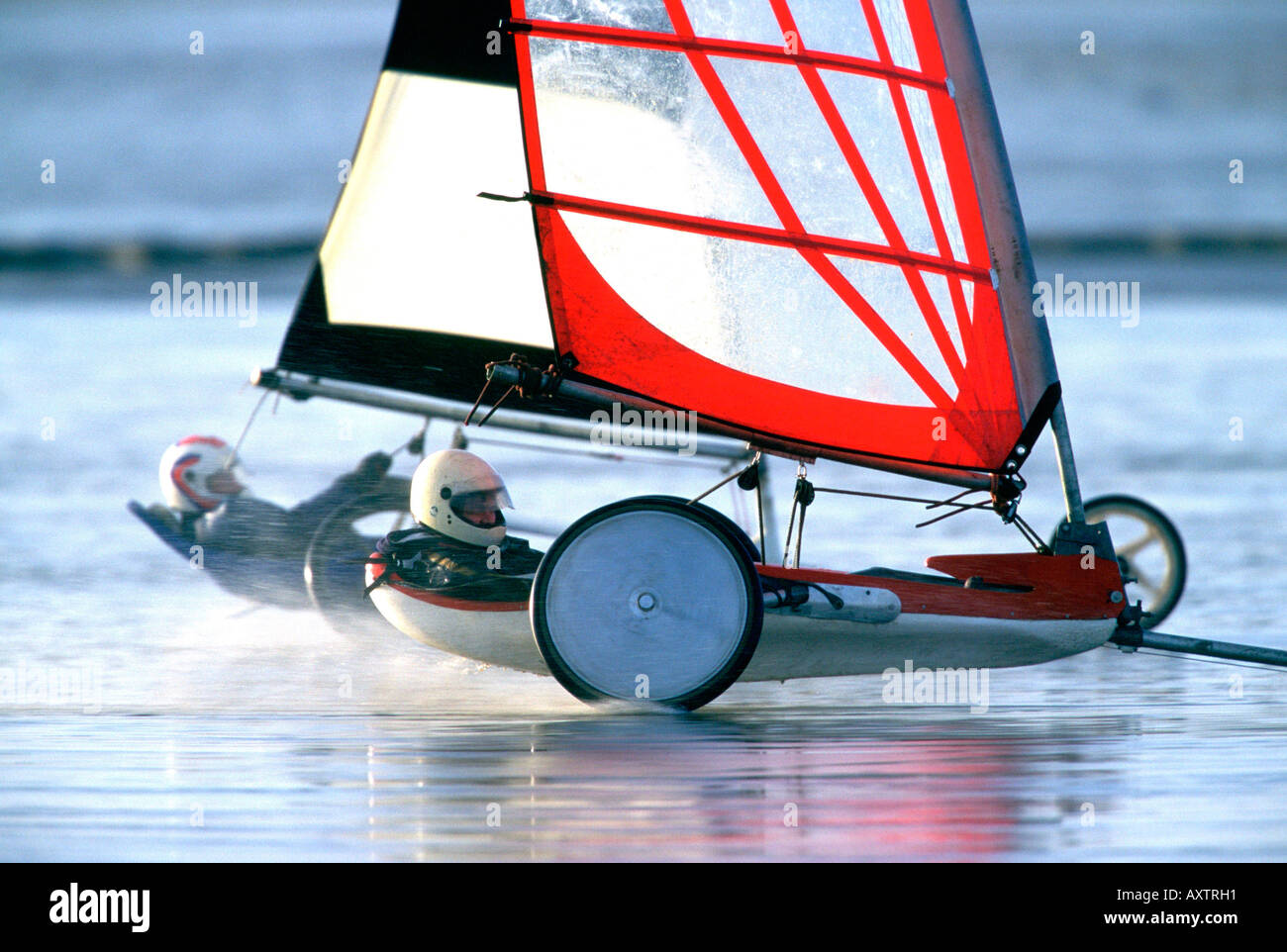 Side profile of two people sailing on the beach Stock Photo - Alamy