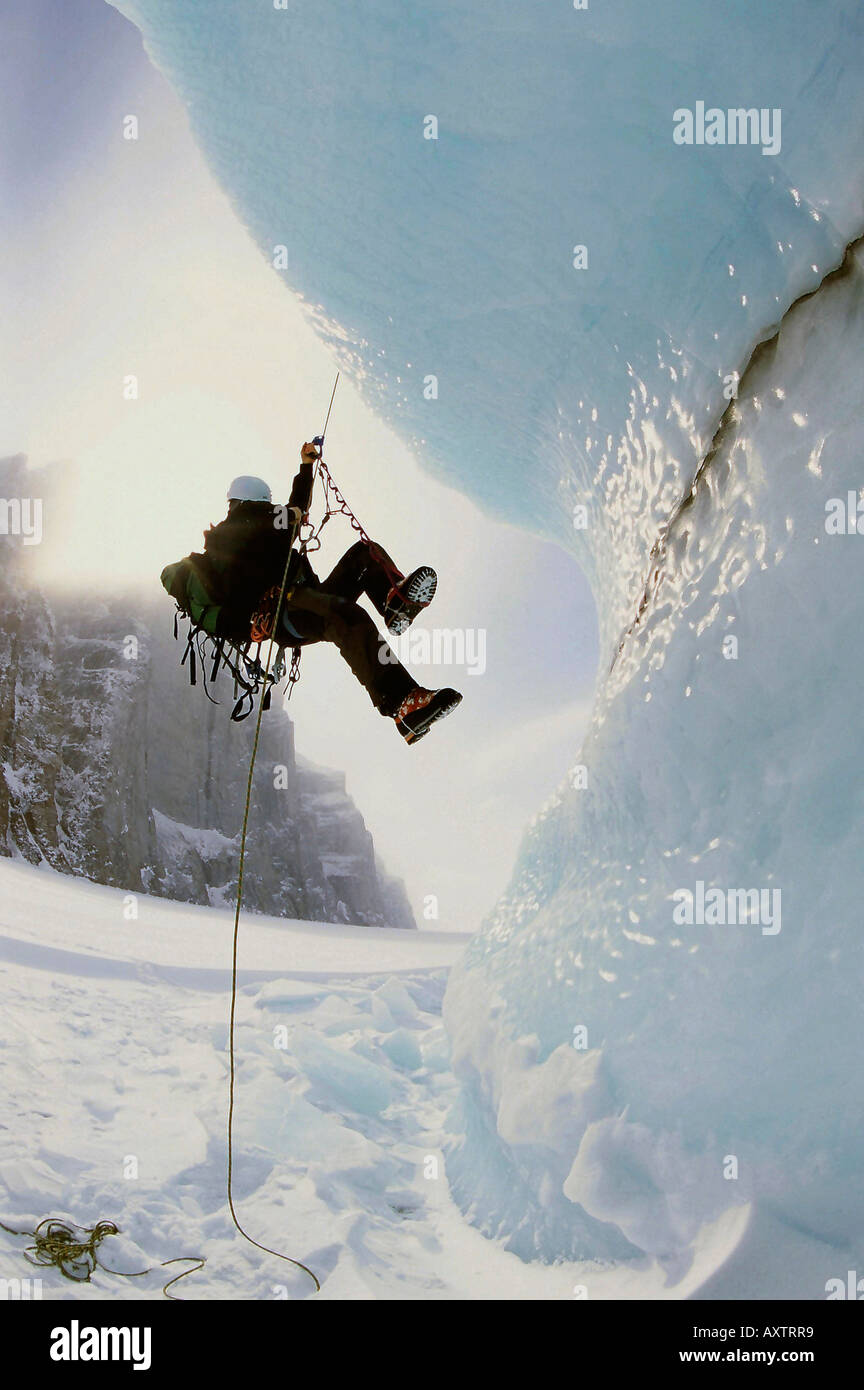 Side profile of a person climbing a mountain Stock Photo - Alamy