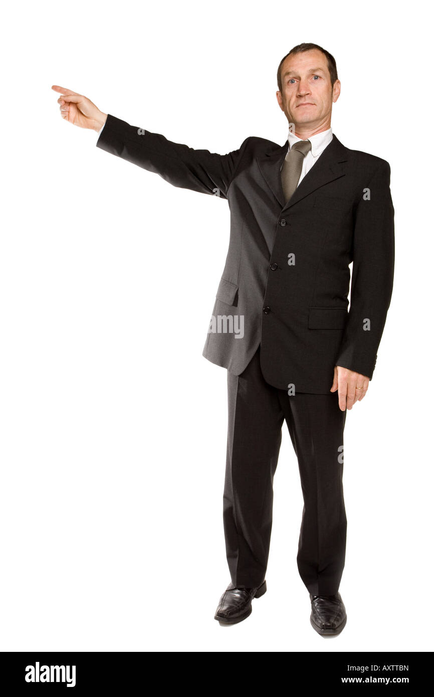 Business man standing in a black suit showing the left direction with ...