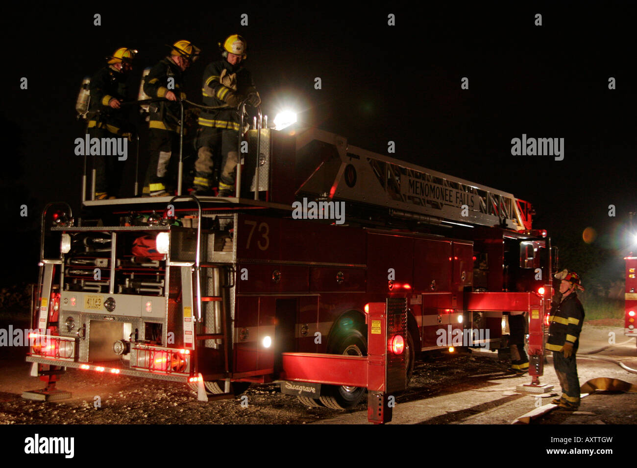The Menomonee Falls Fire Department crew at the rear of the ladder ...