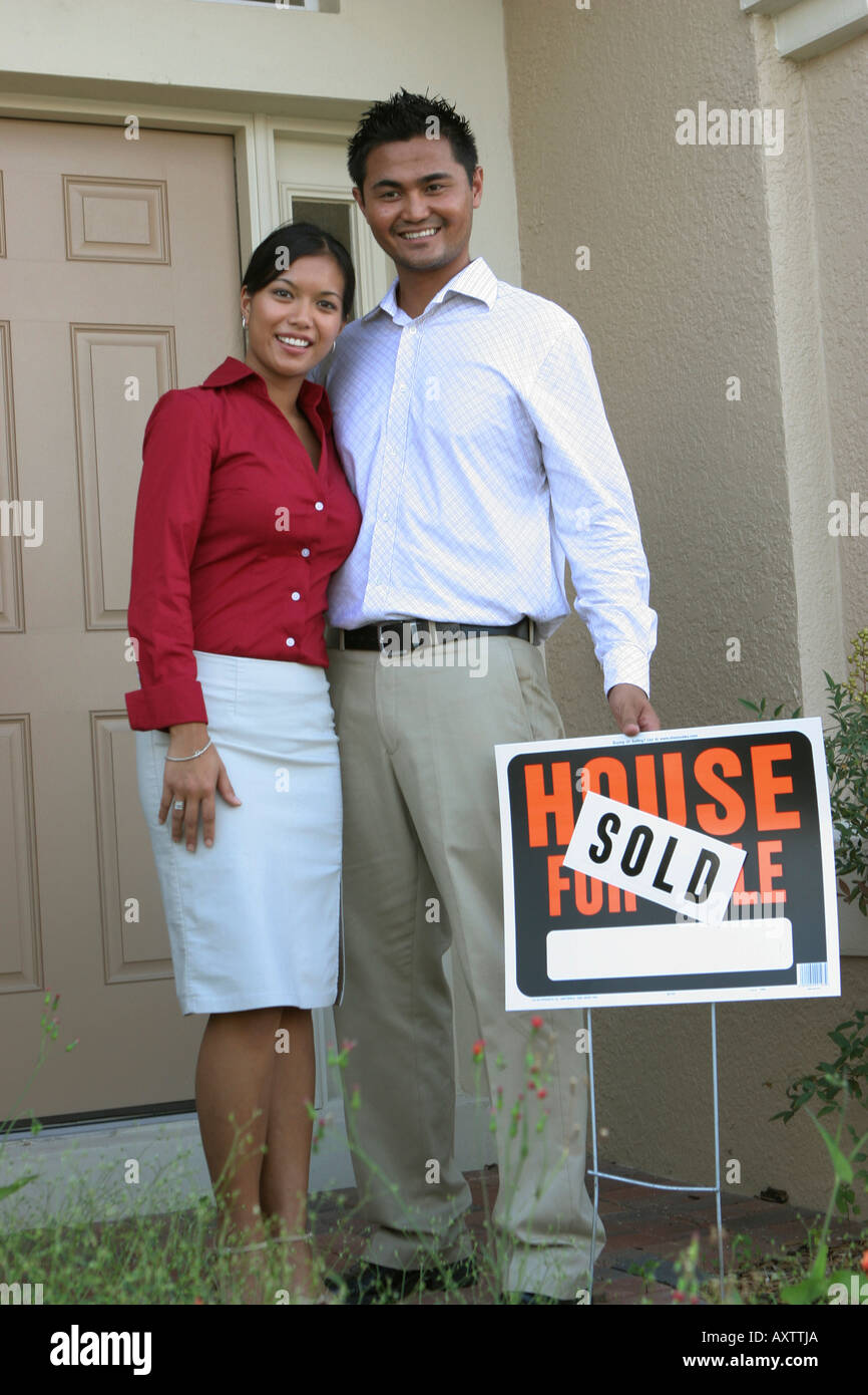 Young couple house sold people outside hi-res stock photography and ...