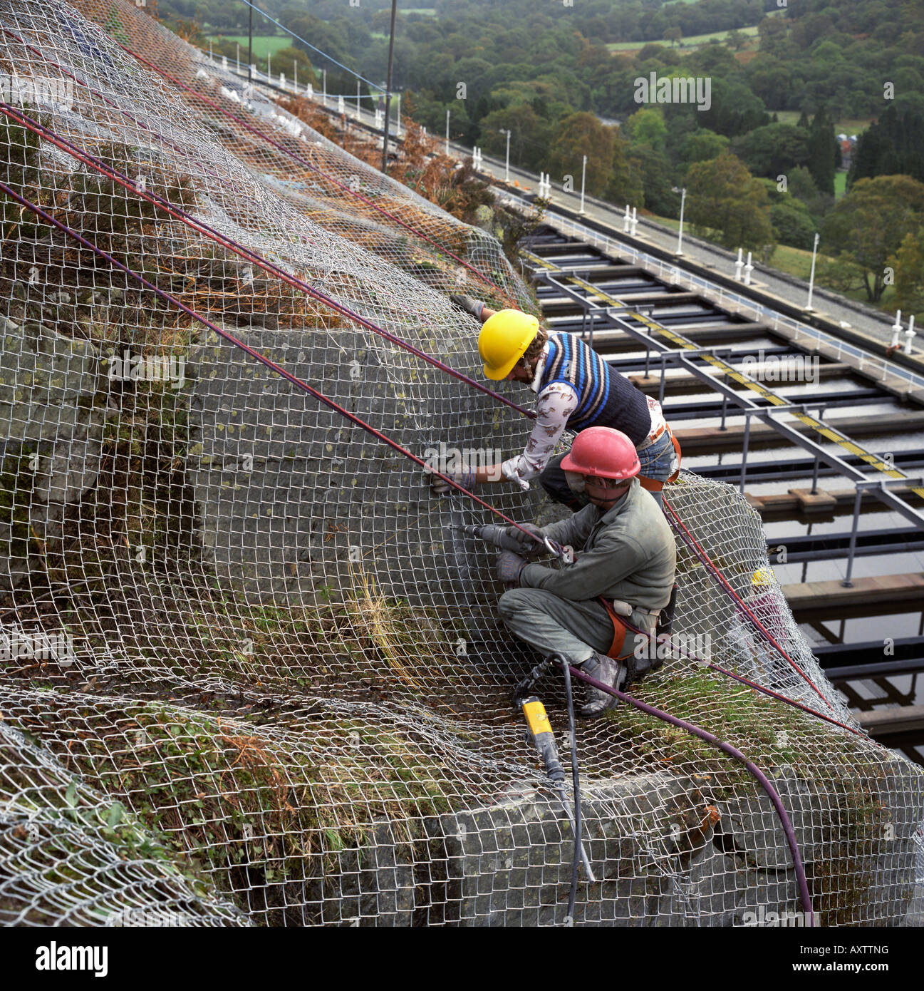 Rock bolting of cliff face to protect water treatment plant below from ...