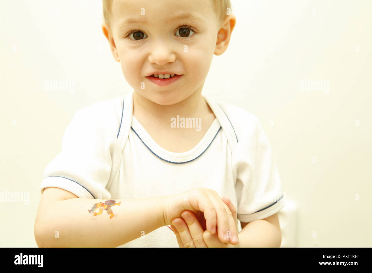 Boy with tattoo on hand Stock Photo - Alamy