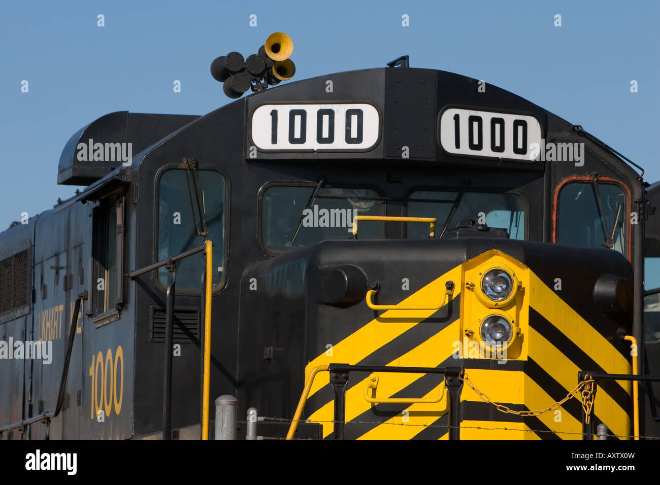 A black and yellow striped diesel locomotive Stock Photo - Alamy