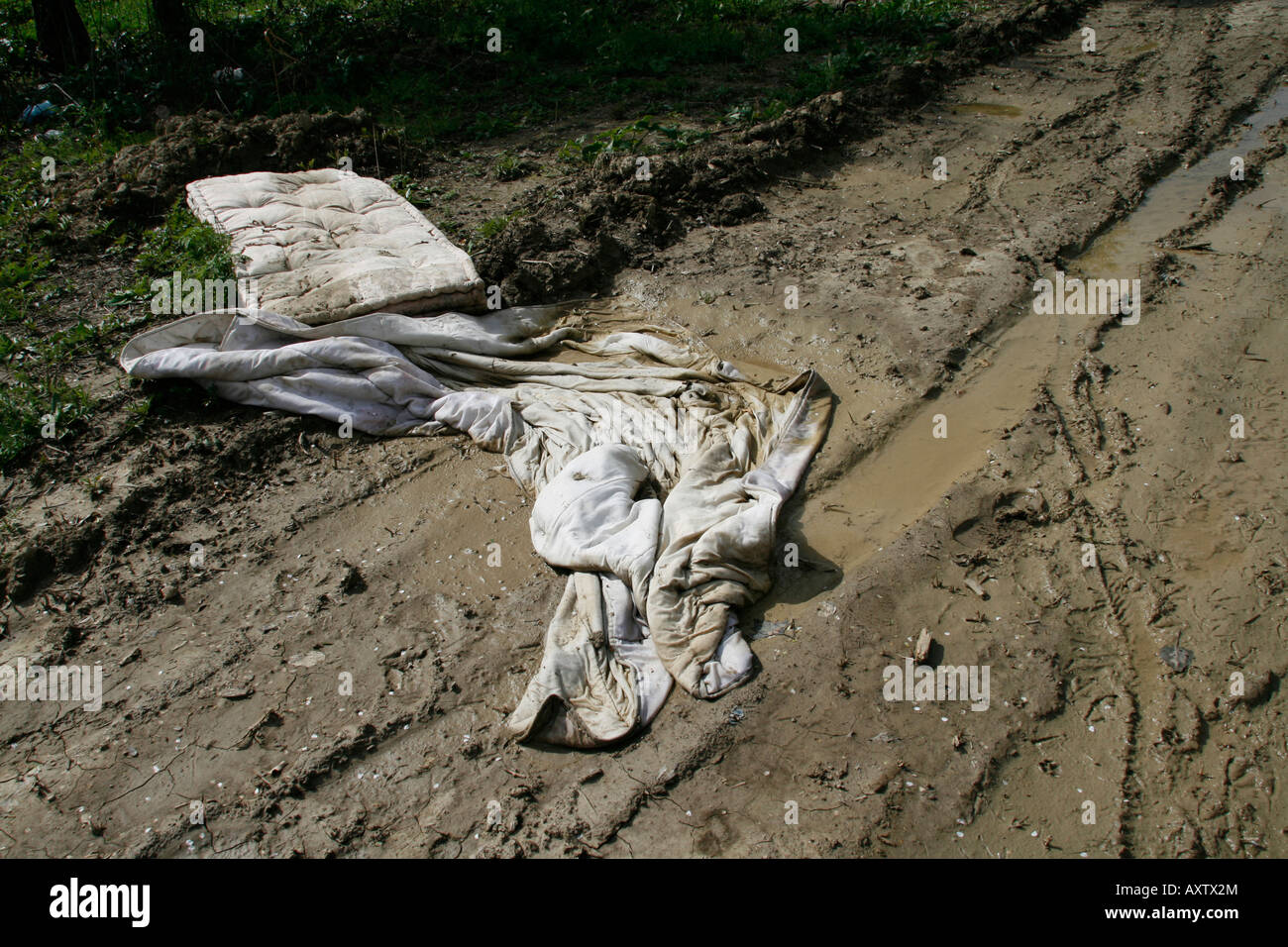 dirty bedding abandoned in field Stock Photo - Alamy