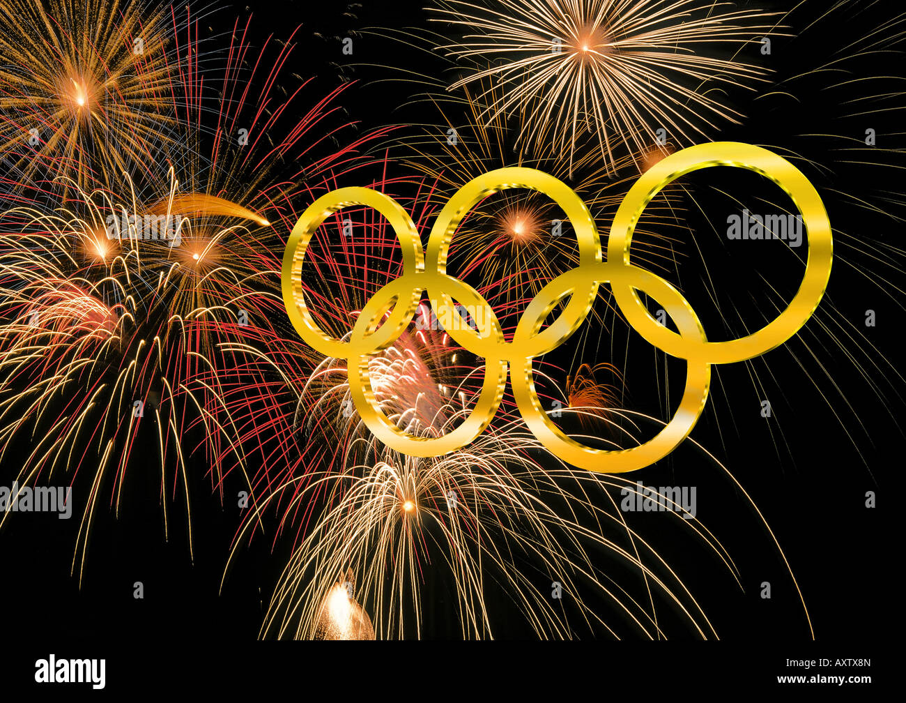 Golden olympic rings against a sky filled with spectacular bursts of ...