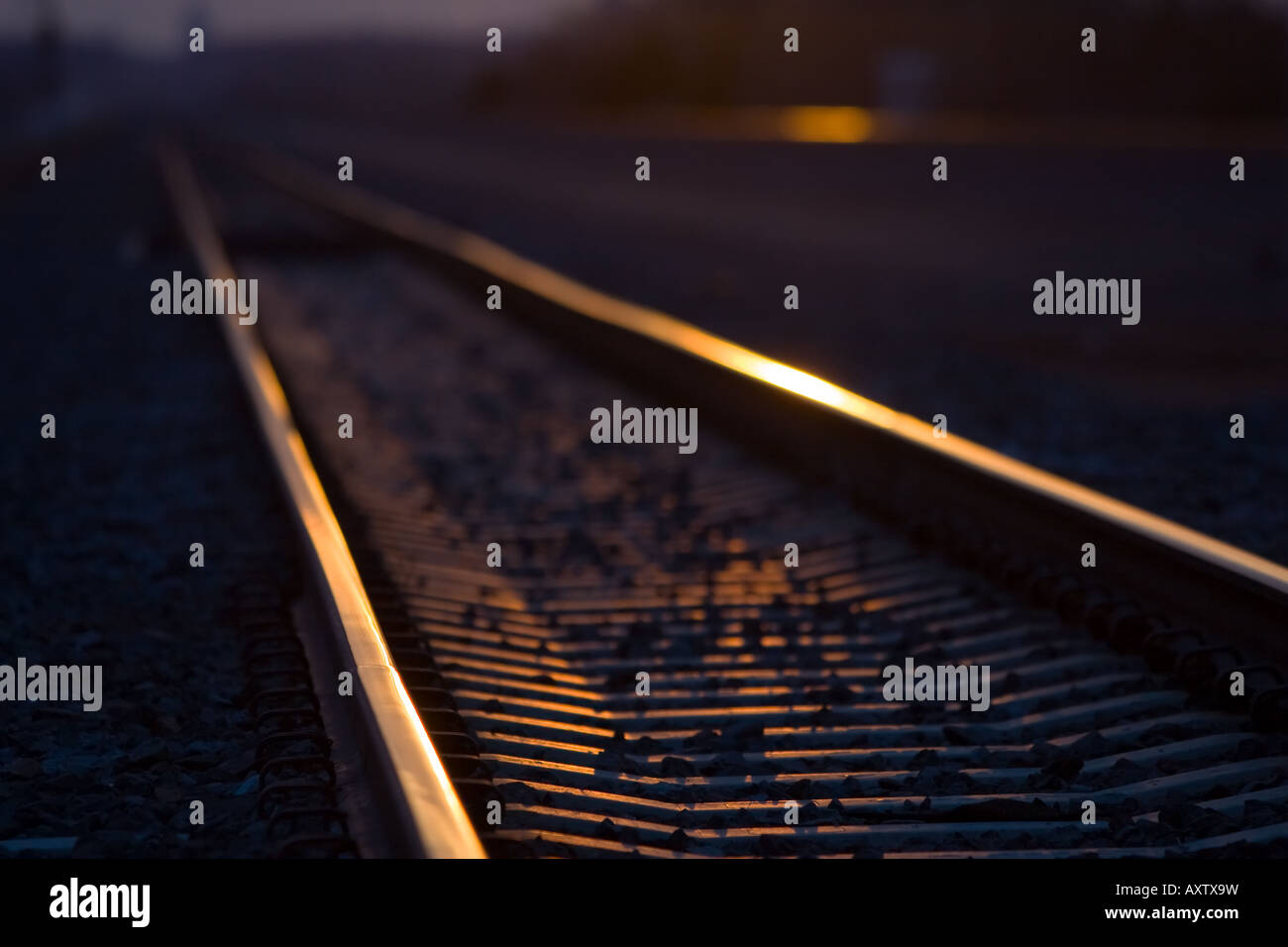 The early morning sunrise light catches the rail of the BNSF mainline ...