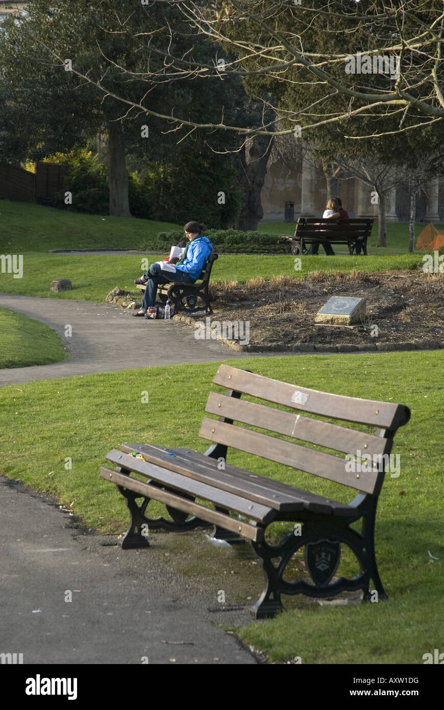 People and benches at a park Stock Photo - Alamy