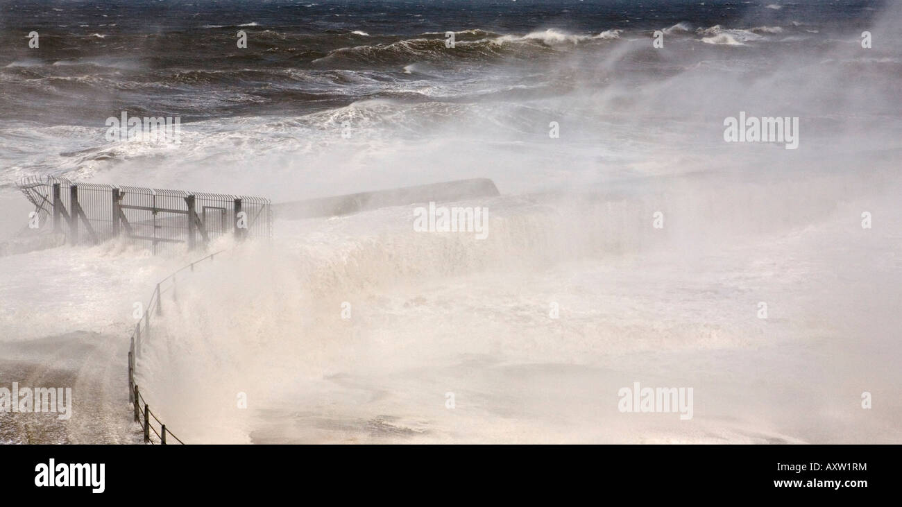 A violent and severe gale blows waves through the locked gates of ...