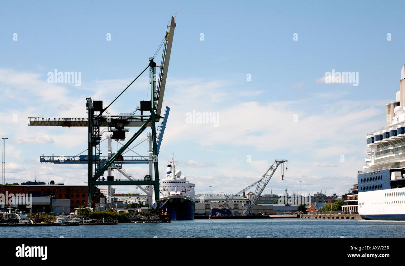 Large cranes for loading ship cargo Stock Photo - Alamy