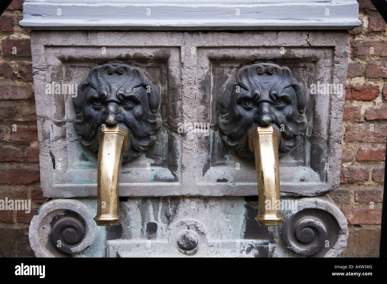 Taps or water spouts which fill a water trough: in the courtyard at the ...