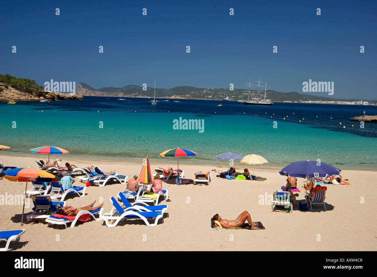 Ibiza beach Cala Bassa beach west coast people Stock Photo - Alamy