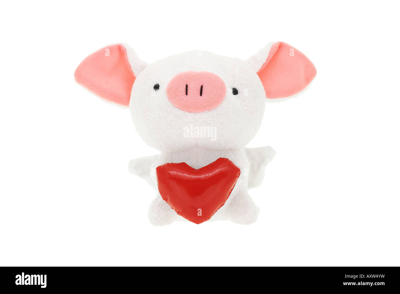 Piggy soft toy with red heart on white background Stock Photo - Alamy