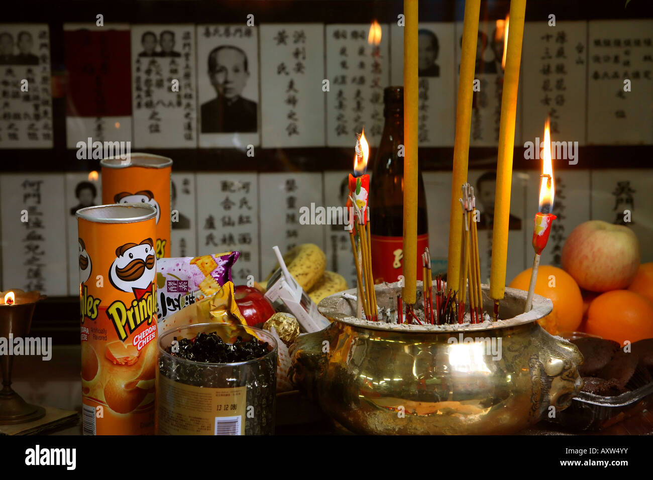 Offerings crowd a shrine for the dead in Yau Ma Tai s Tin Hau buddhist ...