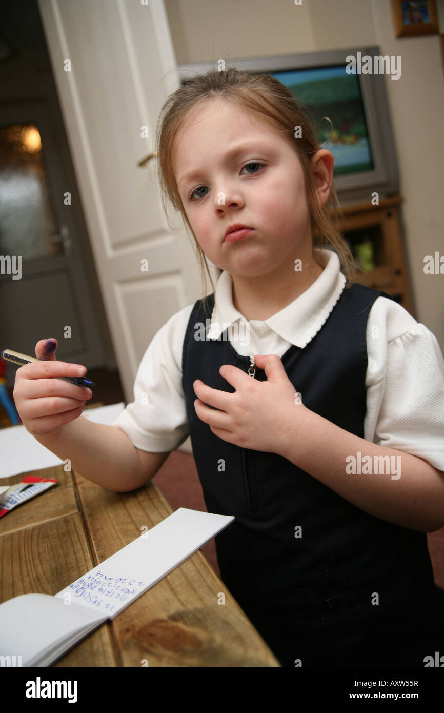 Little girl writing Stock Photo - Alamy