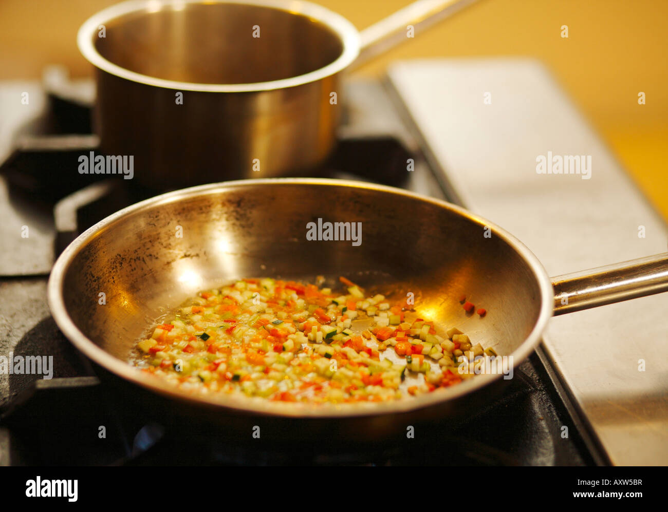 Frying vegetables in the kitchen of the restaurant Stock Photo - Alamy