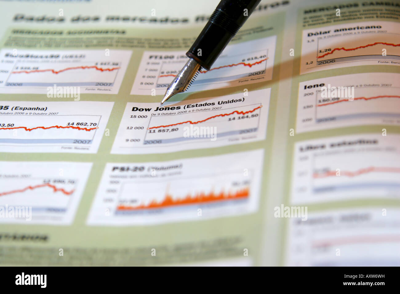 pen pointing to a financial report Stock Photo - Alamy