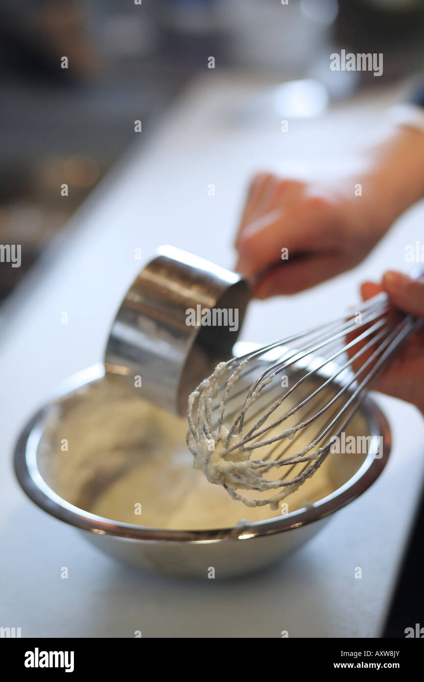 chef whisking batter in stainless steel bowl Stock Photo - Alamy