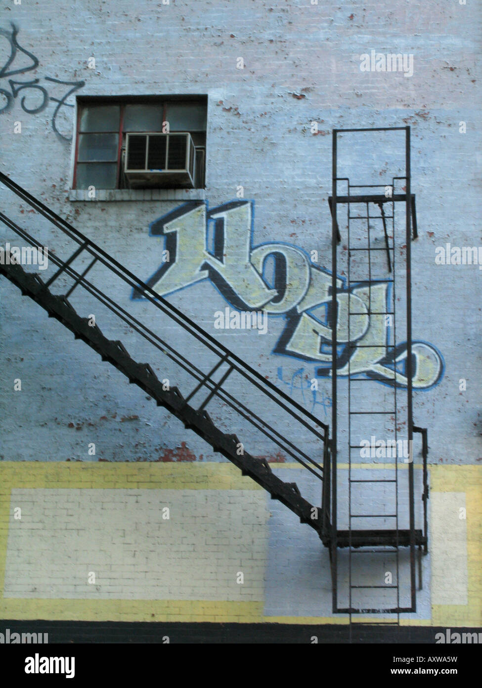 Fire escape in front of wall with graffiti hi-res stock photography and ...