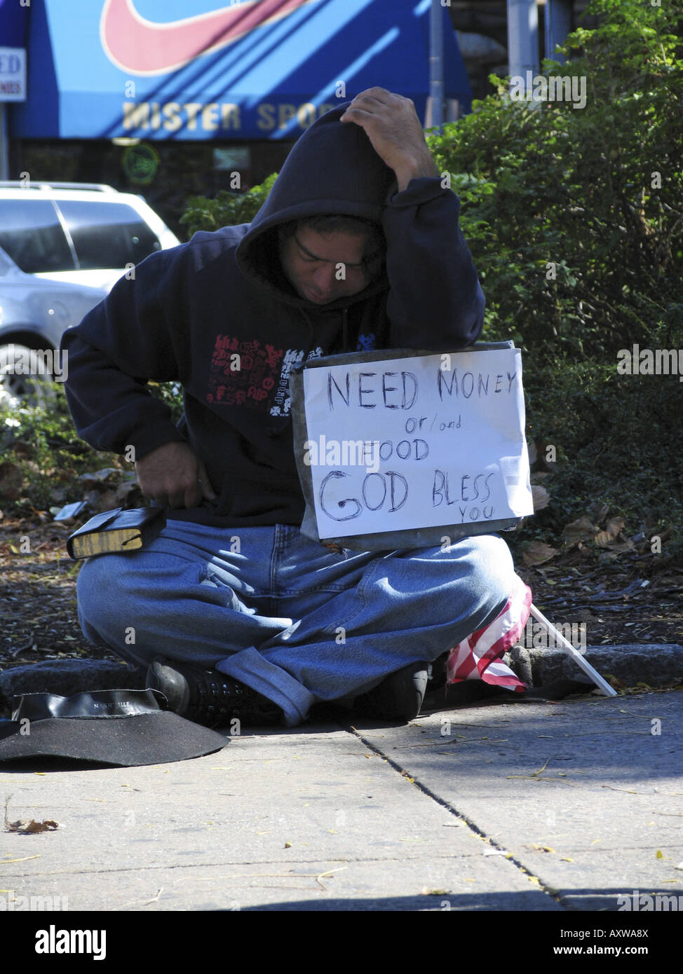 Beggar with paper sign hi-res stock photography and images - Alamy