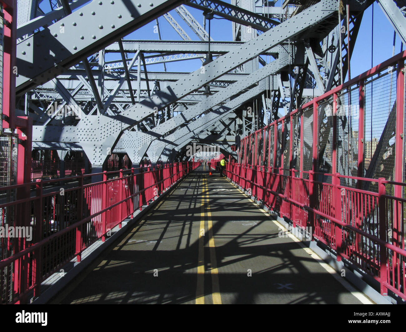 Pedestrian crossing with steel girders of Manhattan Bridge, USA ...