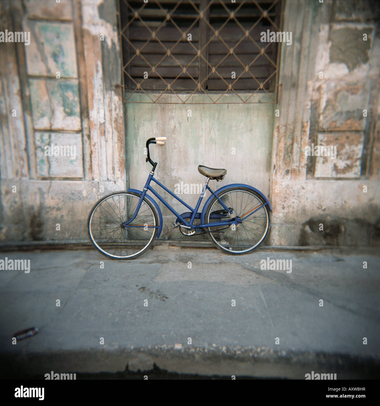Bicycle against a blue wall hi-res stock photography and images - Alamy