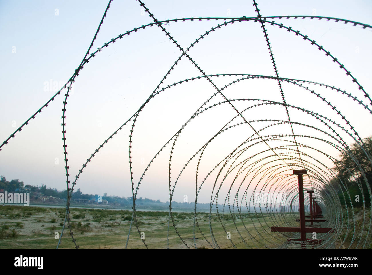 A security fence of razor wire Stock Photo - Alamy