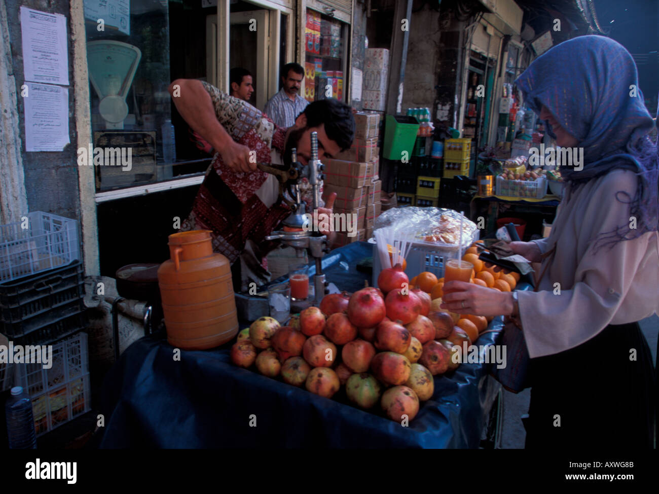 Pomegranate juice vendor squeezing fruit for customer Damascus Syria ...