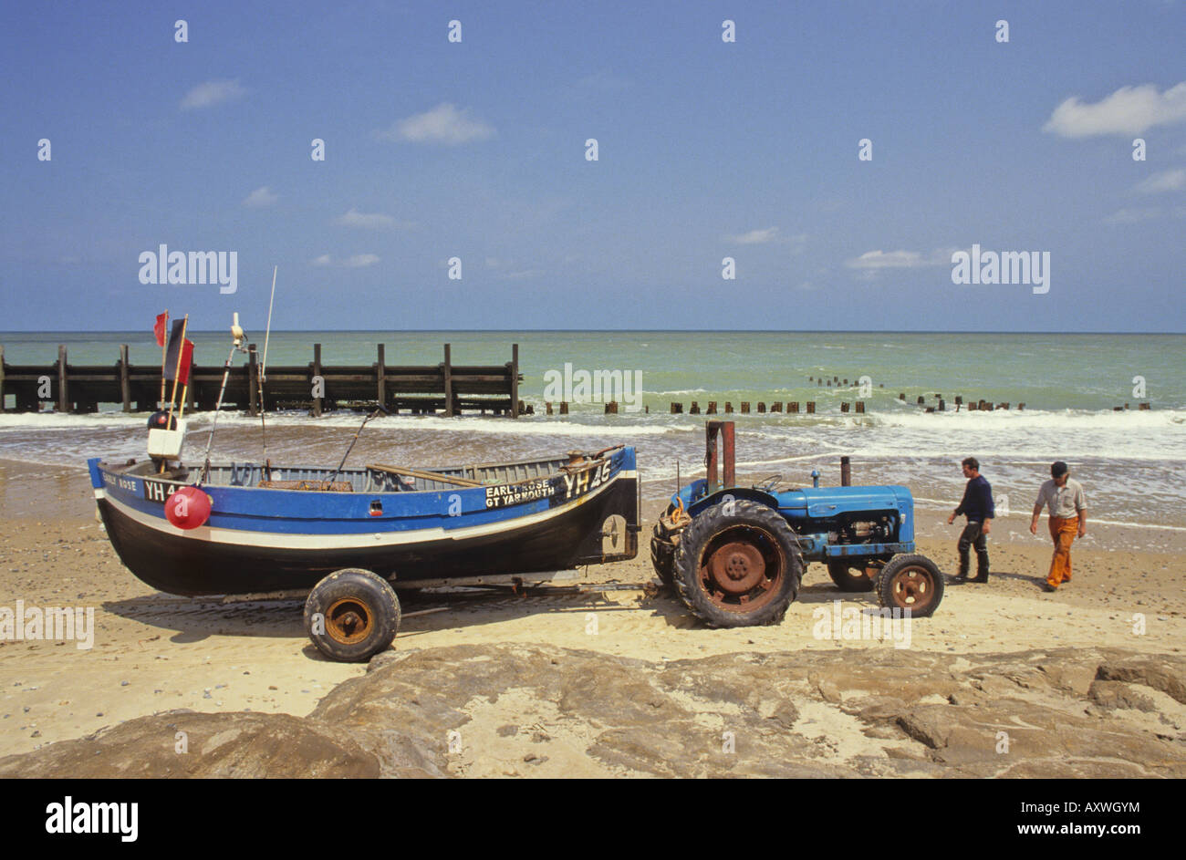 Fishing boat and tractor about to launch into the North Sea at ...