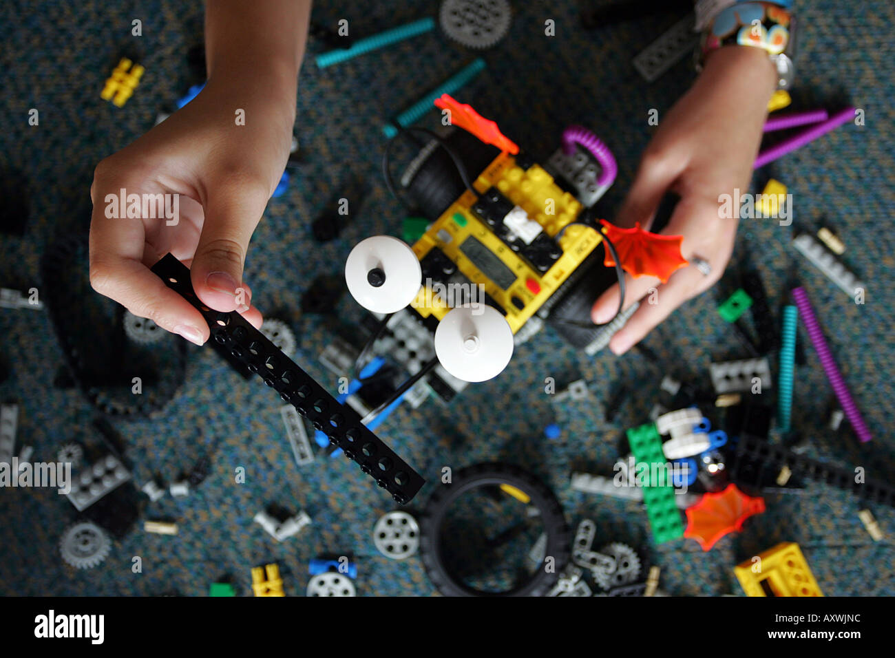 a child playing with lego building bricks Stock Photo - Alamy