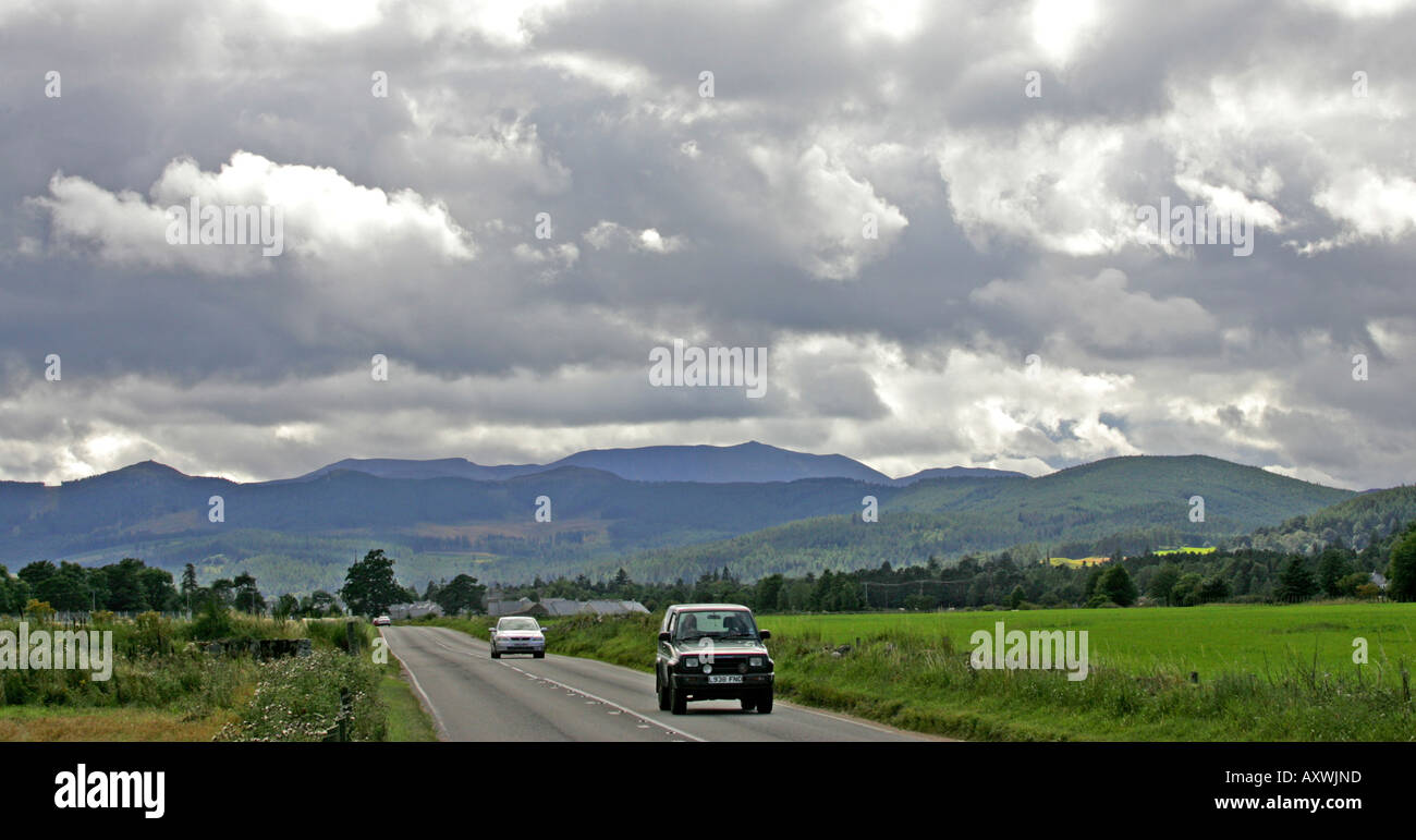 the A93 road from Ballater, Aberdeenshire, Scotland, with mountains of ...