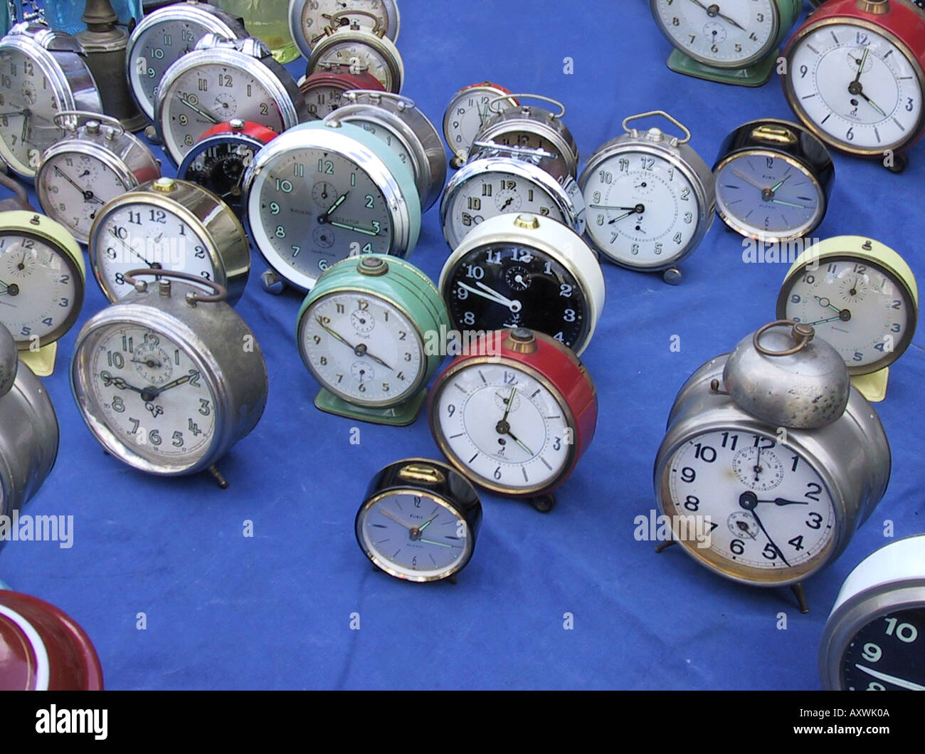 miscellaneous collection of vintage alarm clocks on display at car boot ...