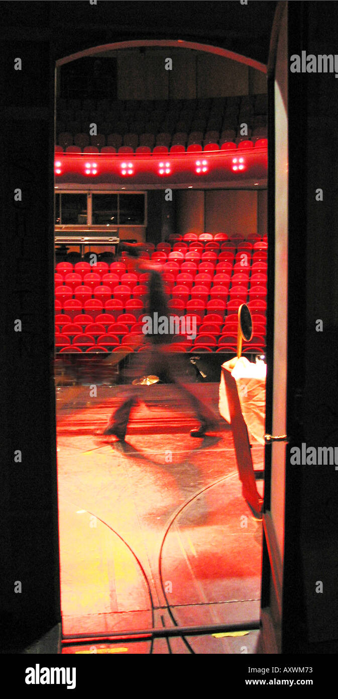 blurred figure hurrying past open stage doors in theatre Stock Photo ...