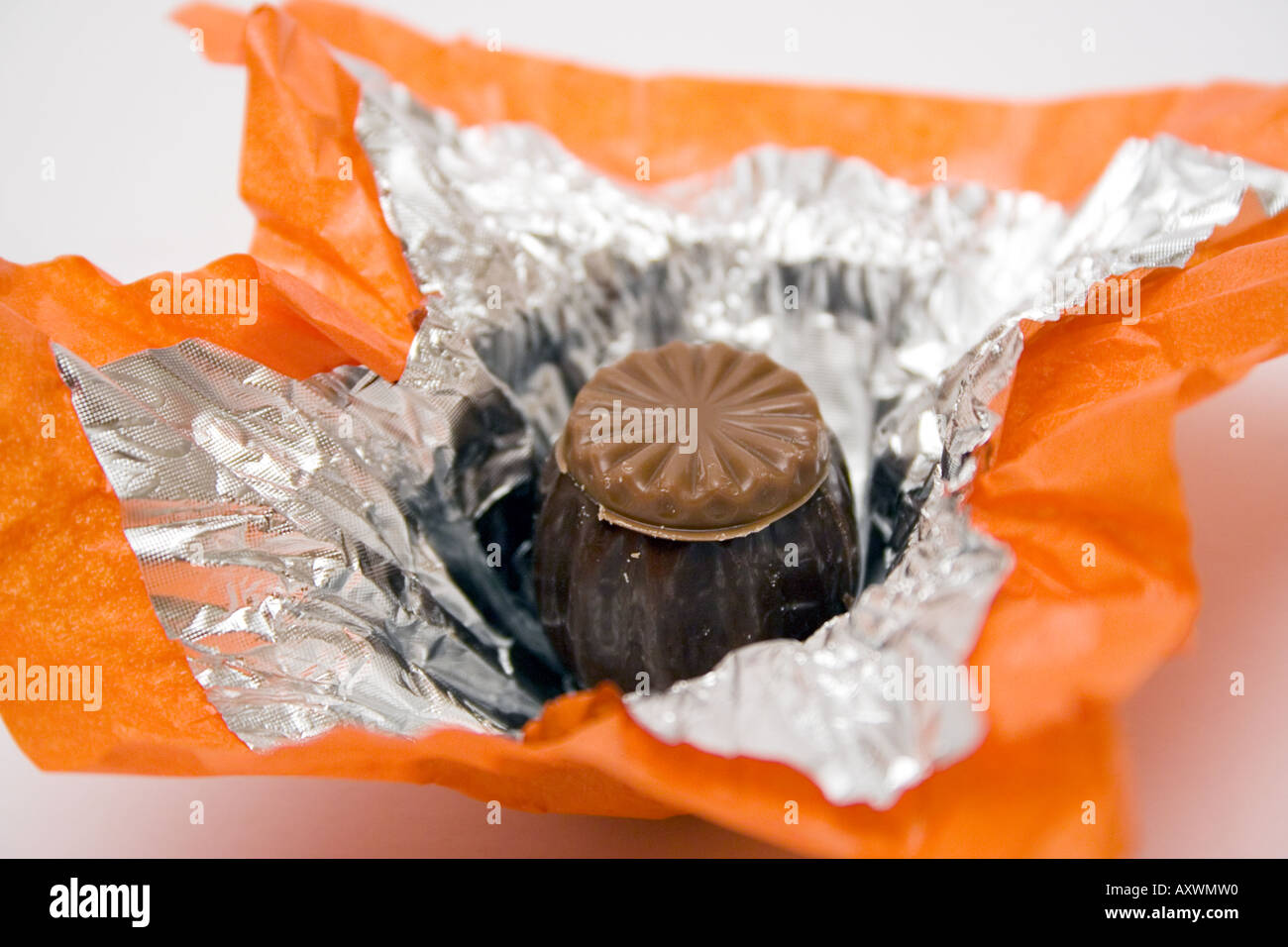 Single Foil Wrapped Chocolate Candy Stock Photo - Alamy